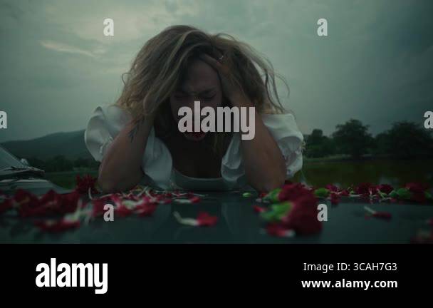 In a dramatic landscape, a distressed bride reveals her deep emotions ...