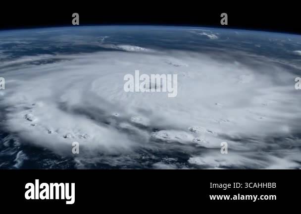 Massive tropical cyclone hurricane viewed from high earth orbit during ...