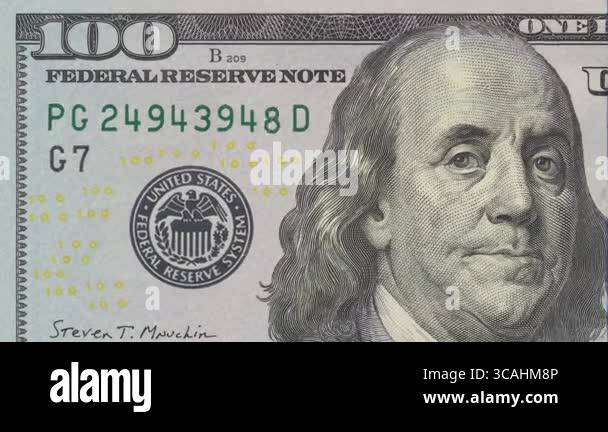 Macro animation of a US one-hundred-dollar bill. Serial numbers count ...