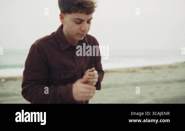 Man Crying While Praying On The Shore During Winter Stock Video Footage ...
