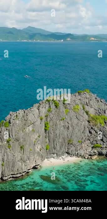 Boats running around Twin Rocks in Miniloc Island. El Nido, Philippines ...