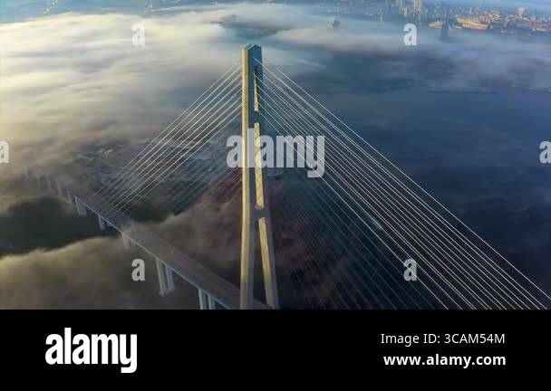 Russky bridge above the clouds aerial view at dawn. A breathtaking ...