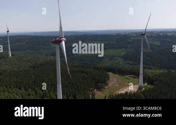 Aerial drone video of wind turbines in the Hurtgenwald, a hilly ...