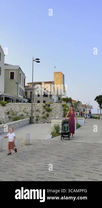 Antibes, France - August 29, 2024: View of people walking near ...