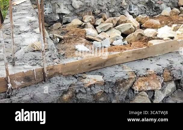 Footage. Side view of building new house. Home foundation in ...