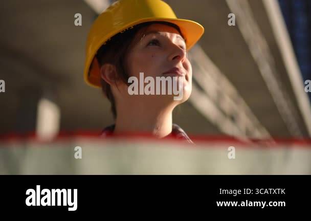 A confident worker dressed in safety gear, showcasing their dedication ...