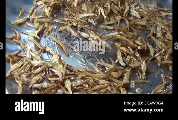 the fried dried fish Stock Video Footage - Alamy