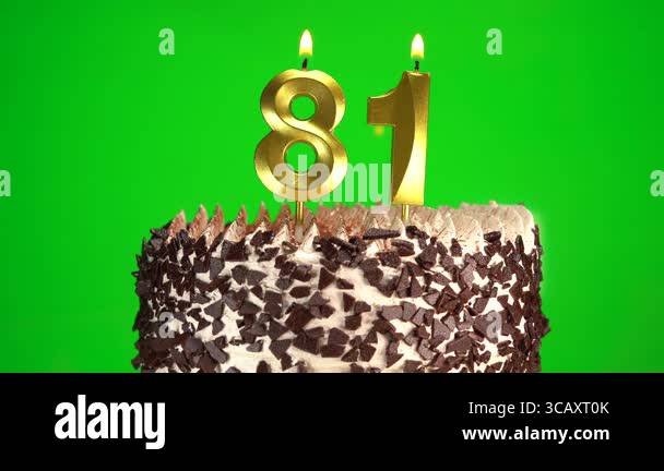 Burning candles number 81 on birthday cake against chroma key ...