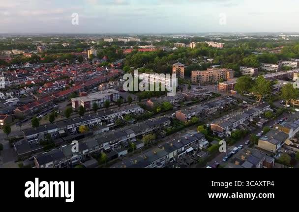 Aerial view of a suburban neighborhood with red-roofed houses ...