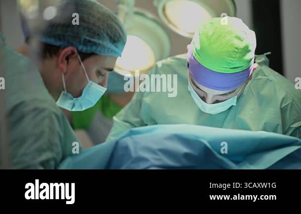 Two skilled surgeons are focused and precise during vital surgery in a ...