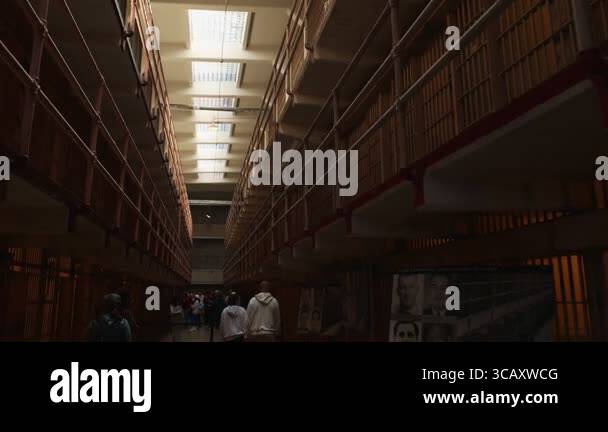 Interior of Alcatraz prison cellblock with rows of metal bars ...