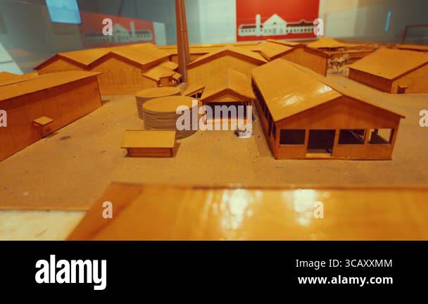 A detailed architectural model showcasing a series of wooden buildings ...