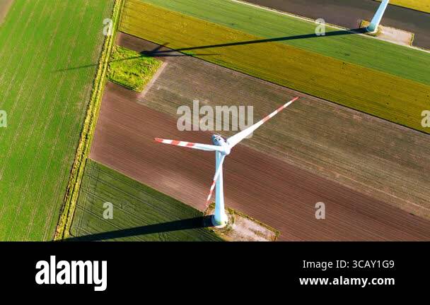 Long blades of wind turbine rotate in the wind. Top view on the ...