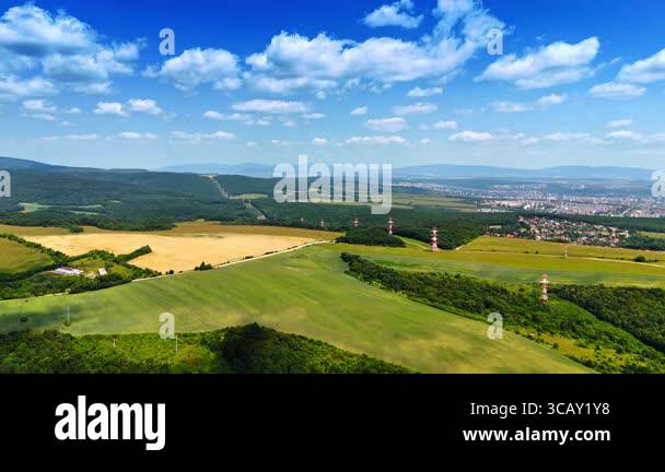 European countryside vista. Aerial view showcases rolling hills, fields ...