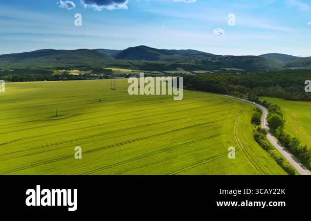 Green fields and hills in Europe. Vibrant green fields stretch across ...