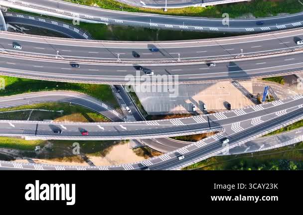 Traffic moves on Europe's roads. Multiple vehicles navigate intricate ...