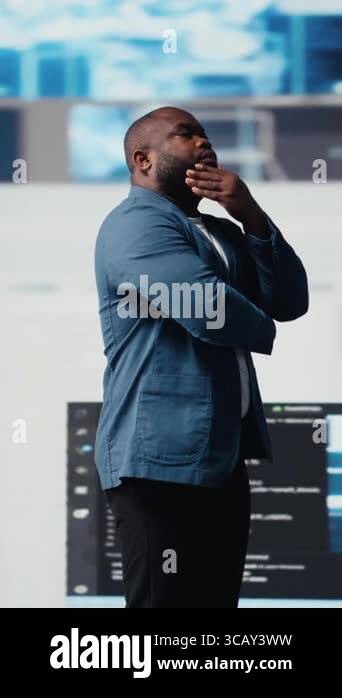 Vertical Video Black software developer immersed in code development, studying programming ...