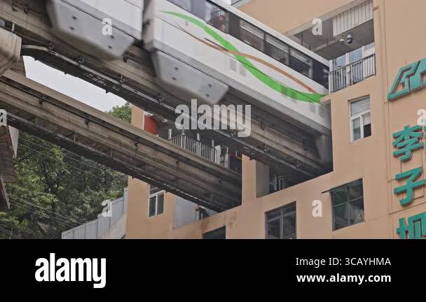 CHONGQING, CHINA - 28 MAY 2025 : train enters liziba station inside a ...