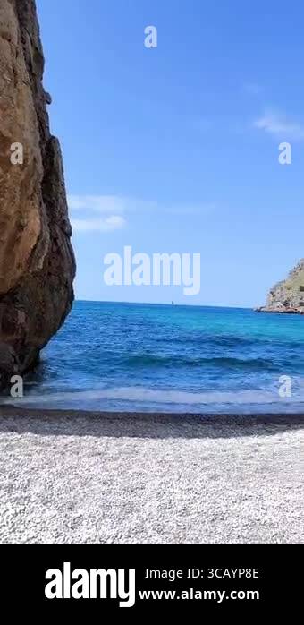 A stunning shot of a hidden cove with crystal clear turquoise water and ...