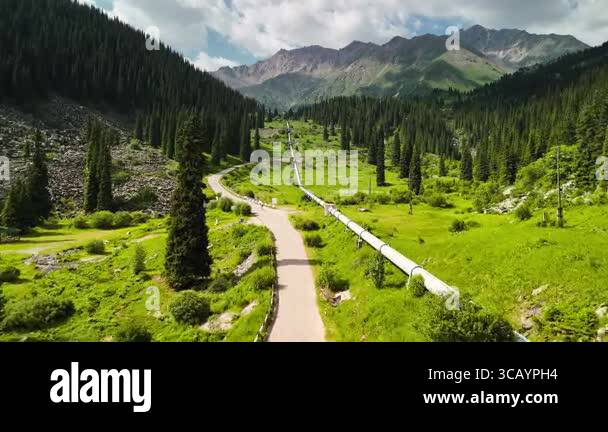 Beautiful aerial drone scenery of bicycle rider on the road in the ...