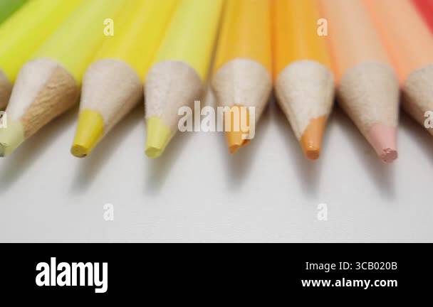 Close-Up of Vibrant Warm-Toned Colored Pencils Lined Up on a White ...