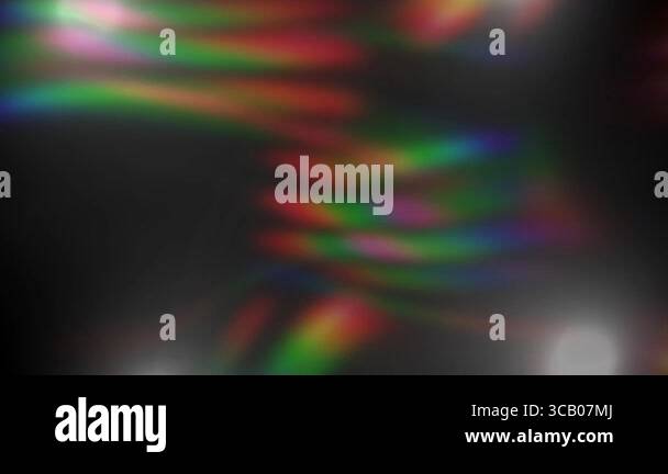 Colorful abstract background with moving lights and glowing shapes ...