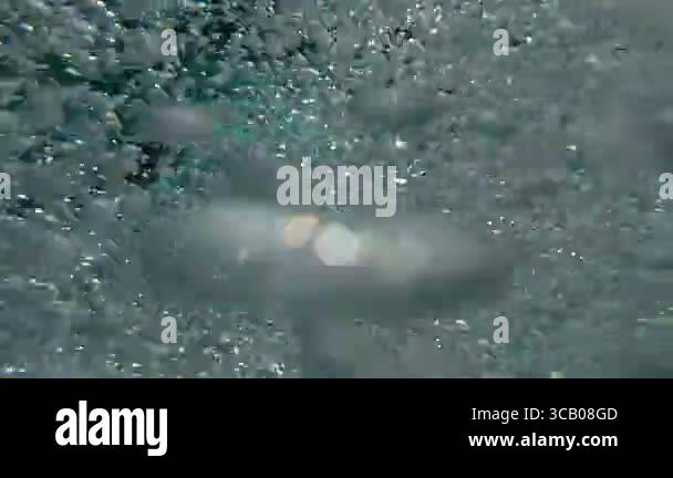 Chaotic movement of bubbles in pool water in sunlight. Abstract blue ...