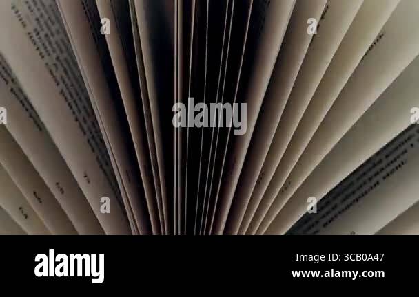 An open book with pages fanned out, creating an intriguing composition ...