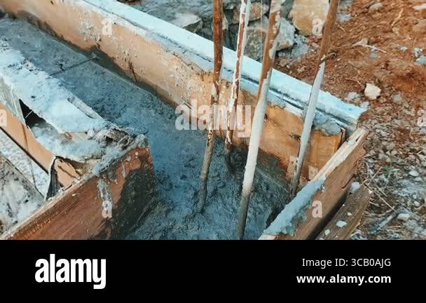 Wet concrete on construction site with precision. New building ...