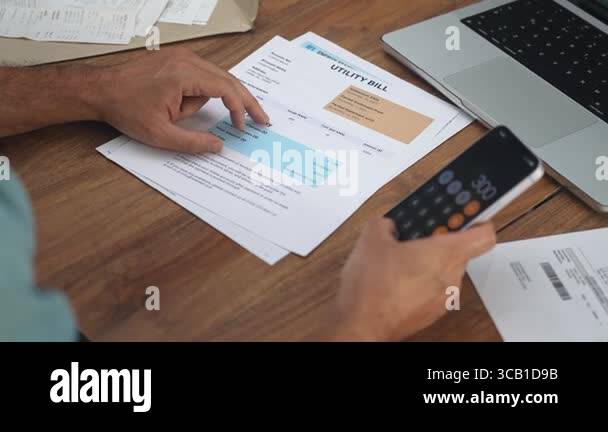 Elderly male office worker holds bills in hands counting amount of ...
