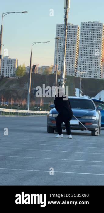 Caucasian man pulling a car with a rope Stock Video Footage - Alamy
