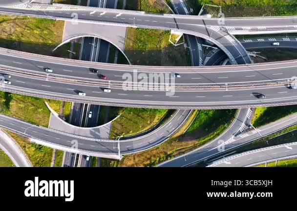 Rising over the complicated road conjunction with cars moving by ...