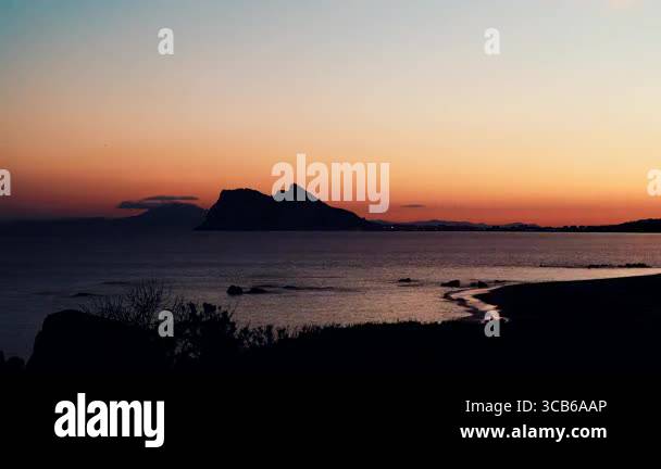 Time lapse of sunset and nightfall over gibraltar rock. View from ...