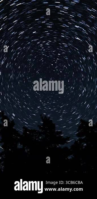 Time lapse of Star trails in the night sky. Stars move around a polar ...