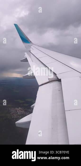 A breathtaking view from a passenger jets window showing the wing flaps ...