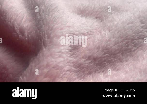 Plush pale pink fabric surface with fine fibres and gentle texture ...