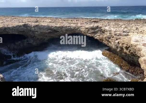 Video footage of solid natural stone sea arch at Playa Canoa formed by ...