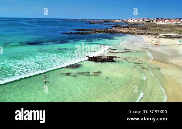 Breathtaking view of a tranquil beach with crystal-clear waters and ...