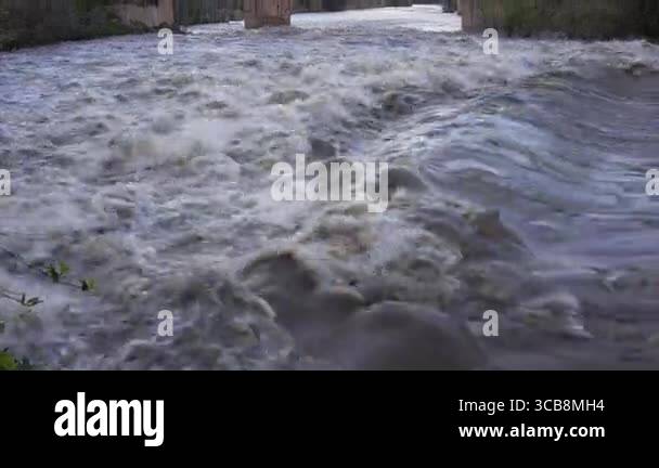 Swelling torrent of water overflow due to heavy rainfall, showcasing ...