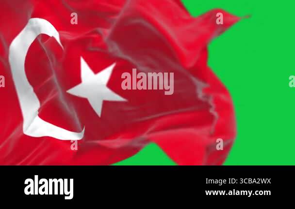 Close-up of Turkish national flag waving in the wind isolated on green ...