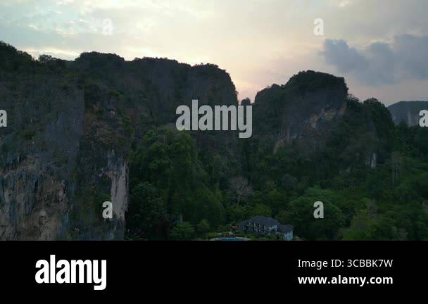 limestone cliffs and lush tropical jungle of Railay Beach, Krabi ...