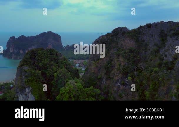 limestone cliffs and lush tropical jungle of Railay Beach, Krabi ...