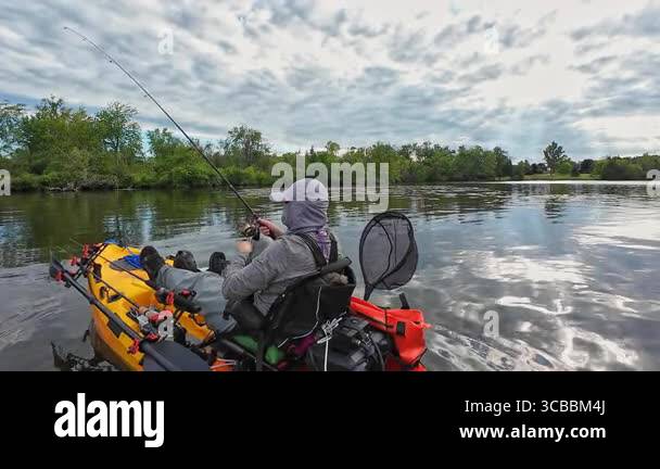 Kayak paddle at lake or pond during fishing game sport action ...