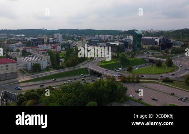 Aerial views capture cars navigating a highway interchange in Vilnius ...