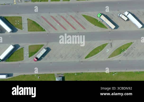 Overhead drone view of a highway rest stop featuring lined asphalt ...