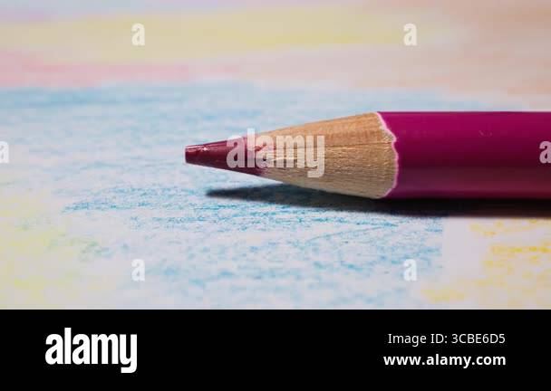 Vibrant Magenta Pencil Against a Colorful Crayon Background Stock Video ...