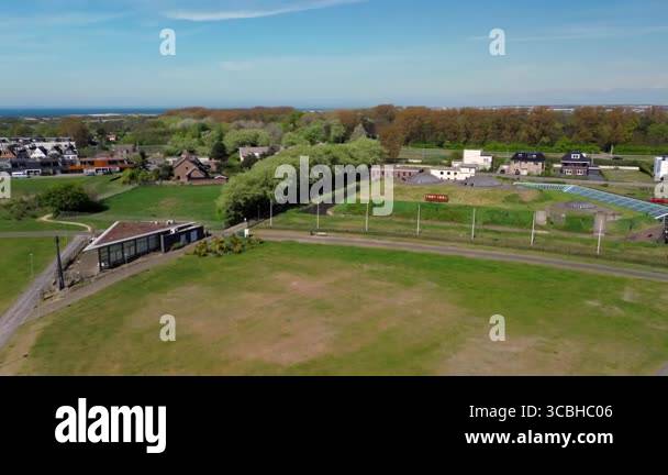 Aerial view of a historic military fort with grass-covered bunkers ...