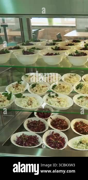 Close-up, showcase with salads in modern canteen, cafeteria, dining ...