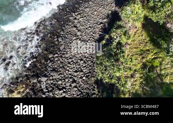 Waves crashing on rocky Fingal Head coastline Stock Video Footage - Alamy