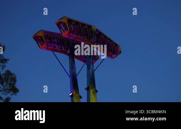 Amusement ride spinning at night with lights Stock Video Footage - Alamy